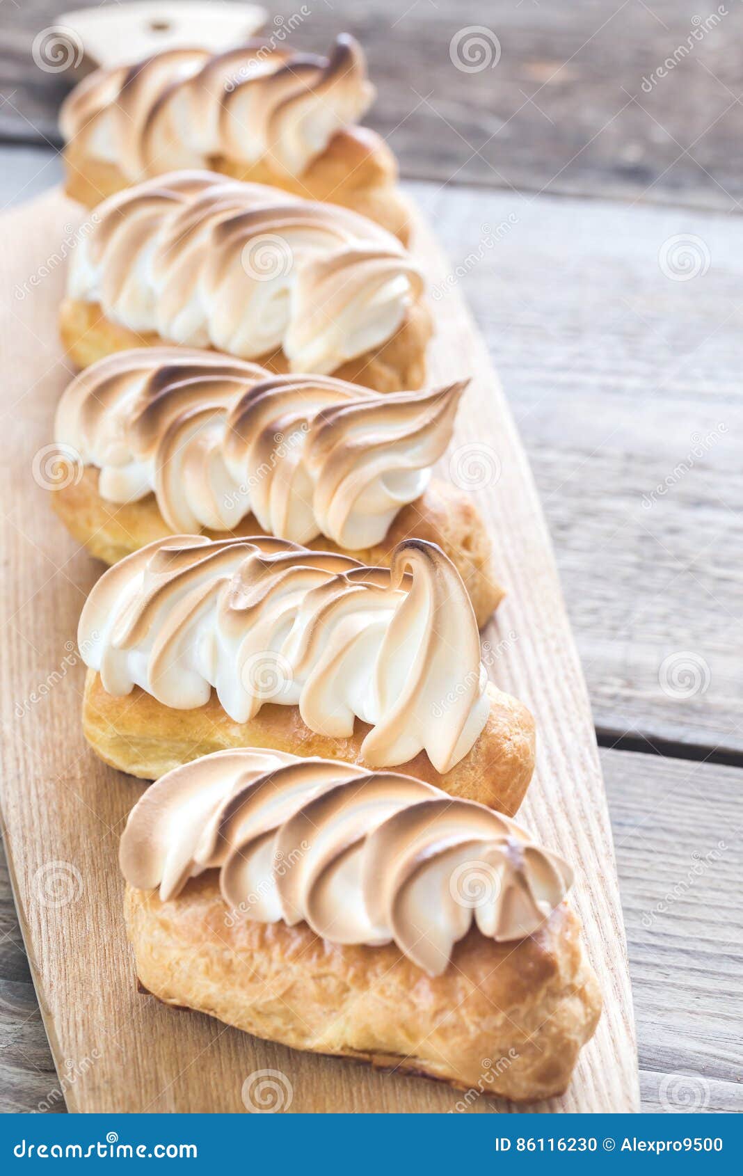 Eclairs with Lemon Curd and Meringue Stock Photo - Image of group ...
