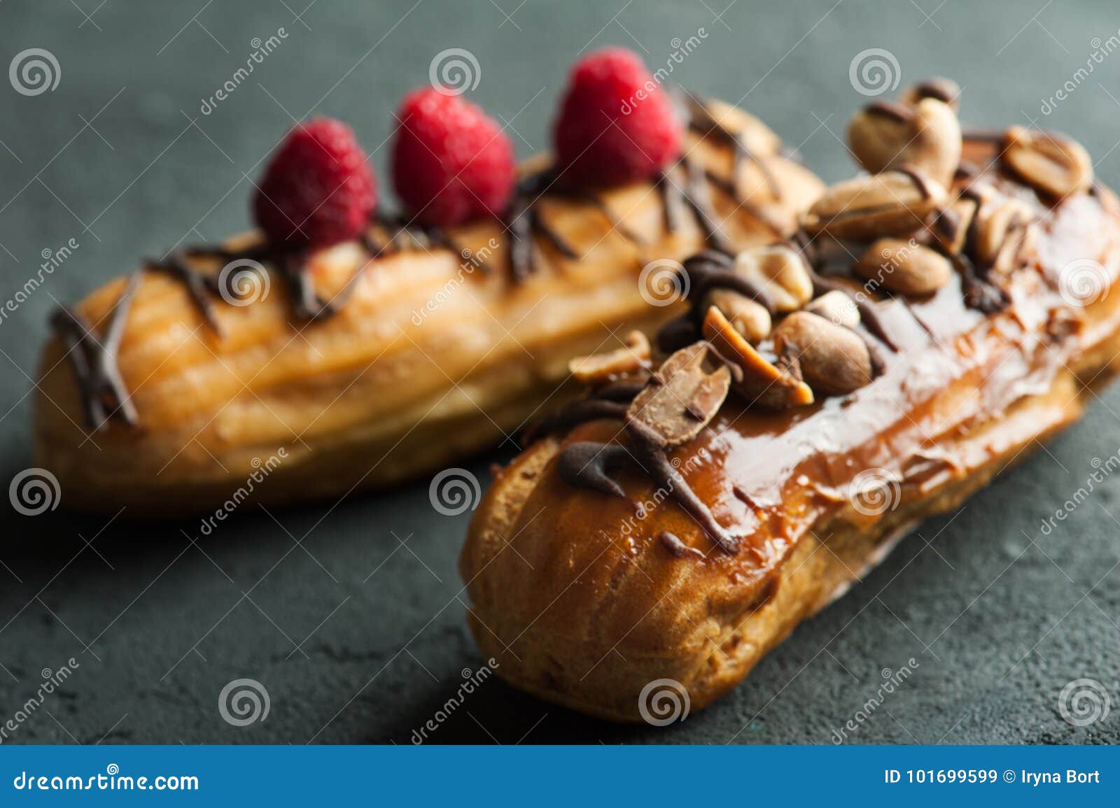 Eclairs with Peanuts, Chocolate Icing and Raspberries Stock Image ...