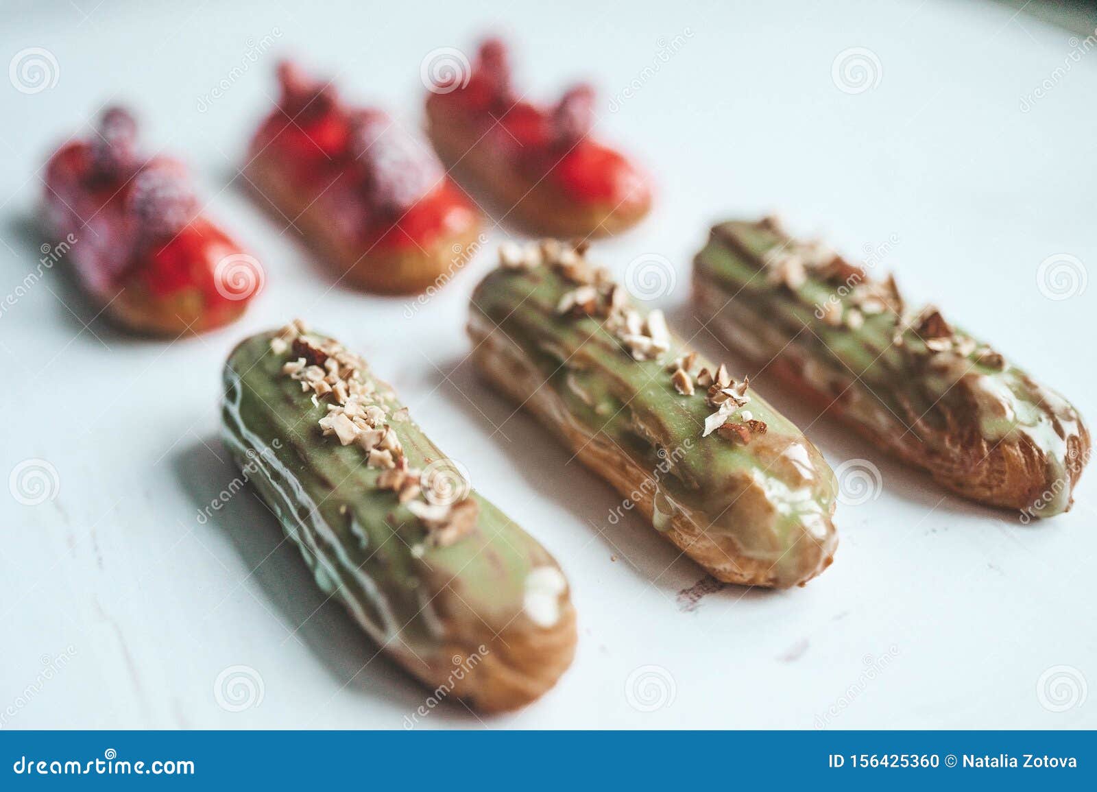 Different Eclairs on White Background Stock Photo - Image of creamy ...