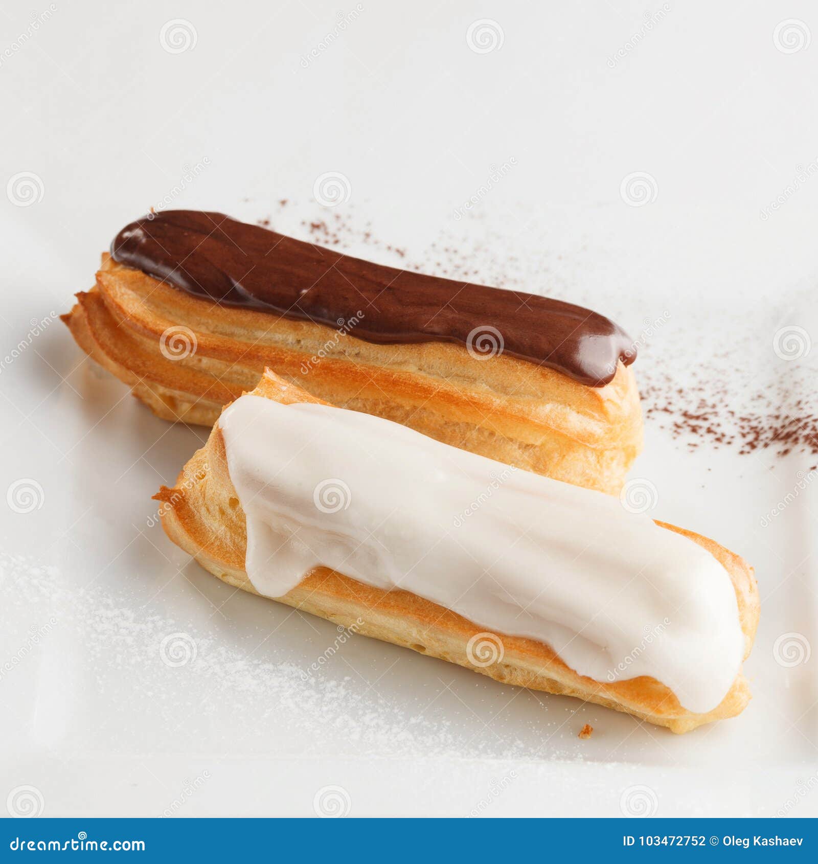 Eclairs on a white plate stock photo. Image of culinary - 103472752