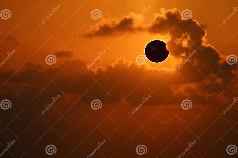 Eclipse on the Orange of Sunset Sky and Back Little Soft Cloud Stock ...