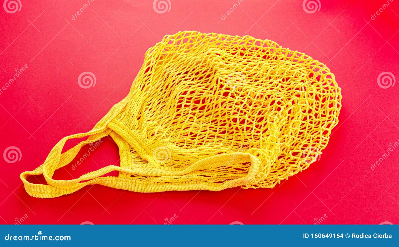 One Reusable Cotton Net Bags or Mesh Bags on Coloured Background Stock ...