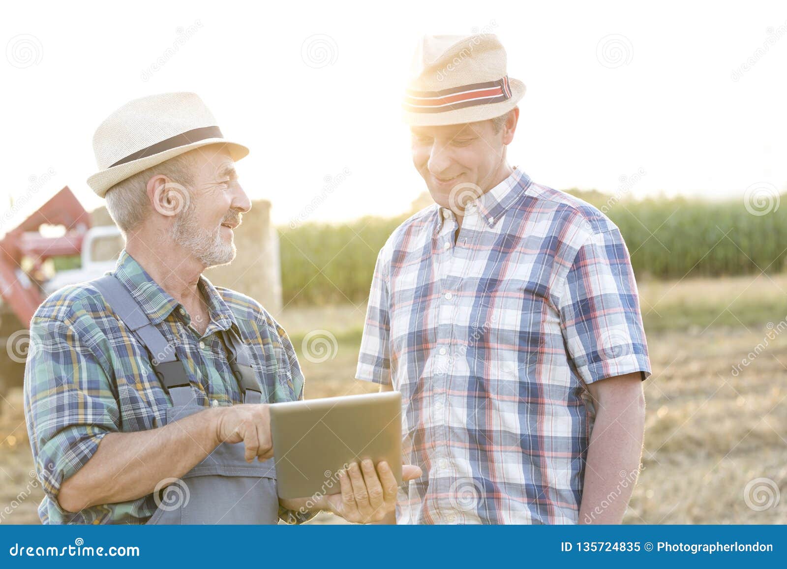 Smiling Farmers Communicating Over Digital Tablet at Farm Stock Image ...