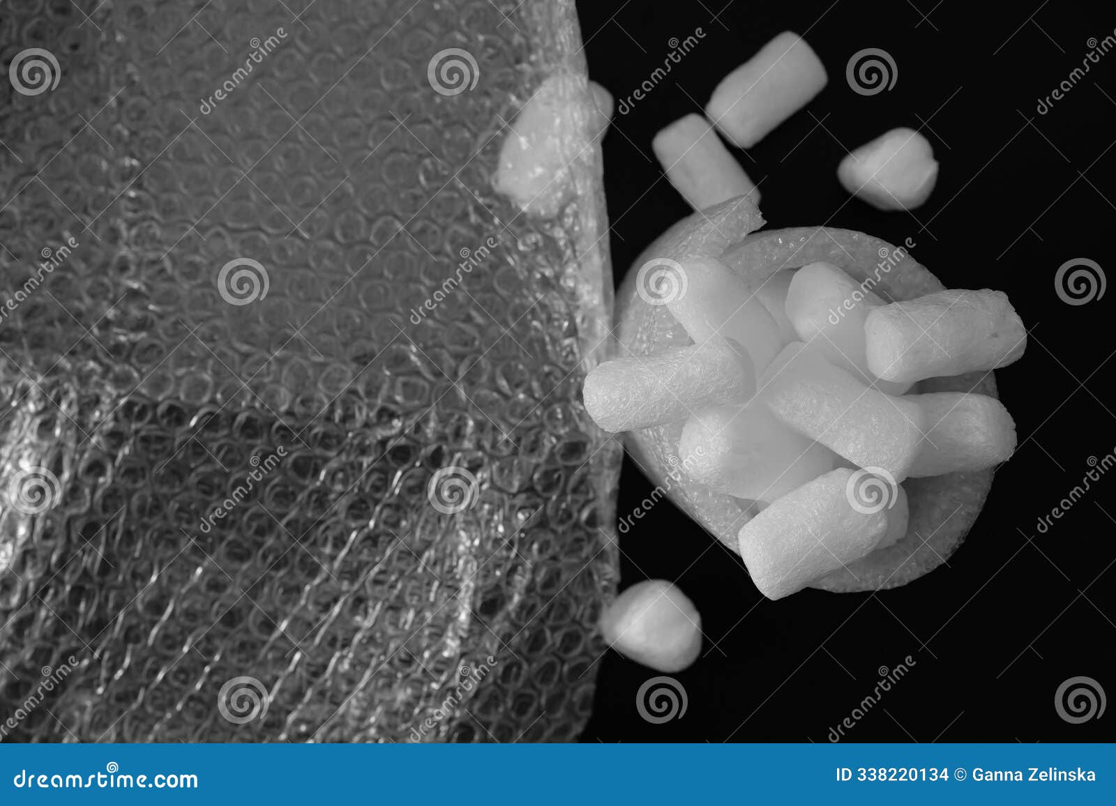 Eco-friendly Packing Peanuts, and Booble Wrap on the Black Background ...