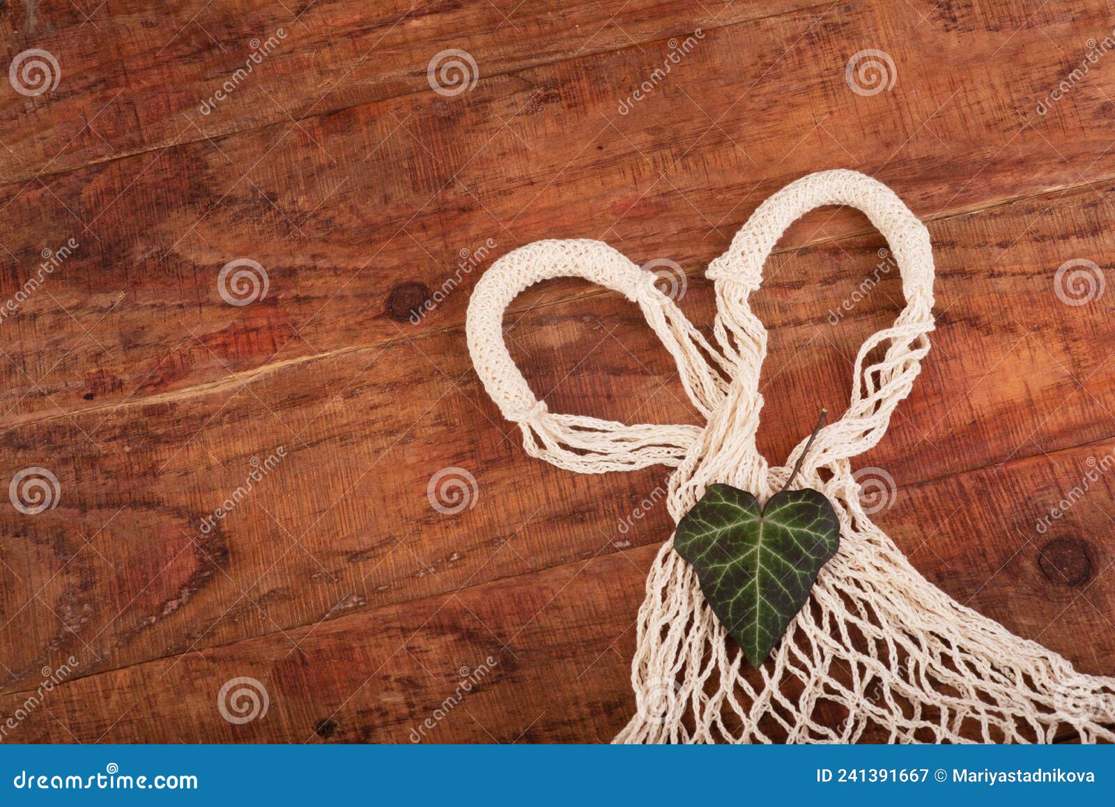 Eco Friendly String Bag and Green Leaf on Wooden Background ...