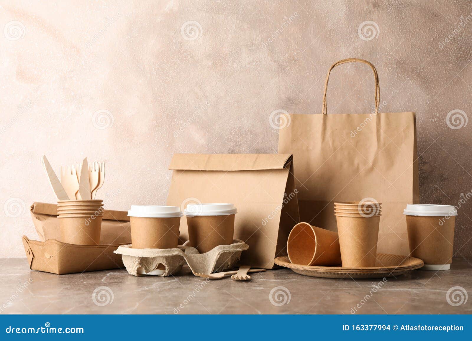 Eco - Friendly Tableware and Paper Bag on Grey Table Stock Photo ...