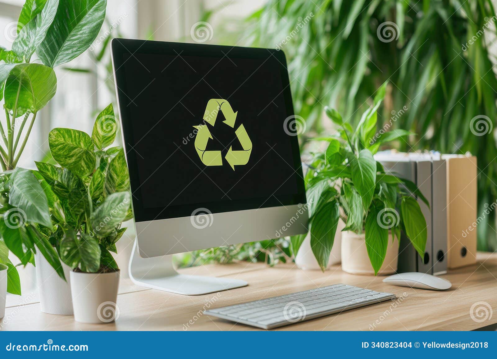Eco Friendly Workspace with Computer Monitor Displaying Recycle Symbol ...