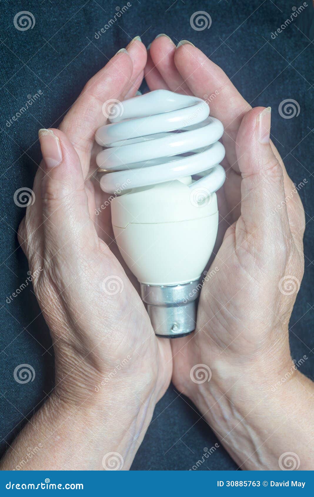 Eco light bulb hands stock image. Image of bright, success - 30885763
