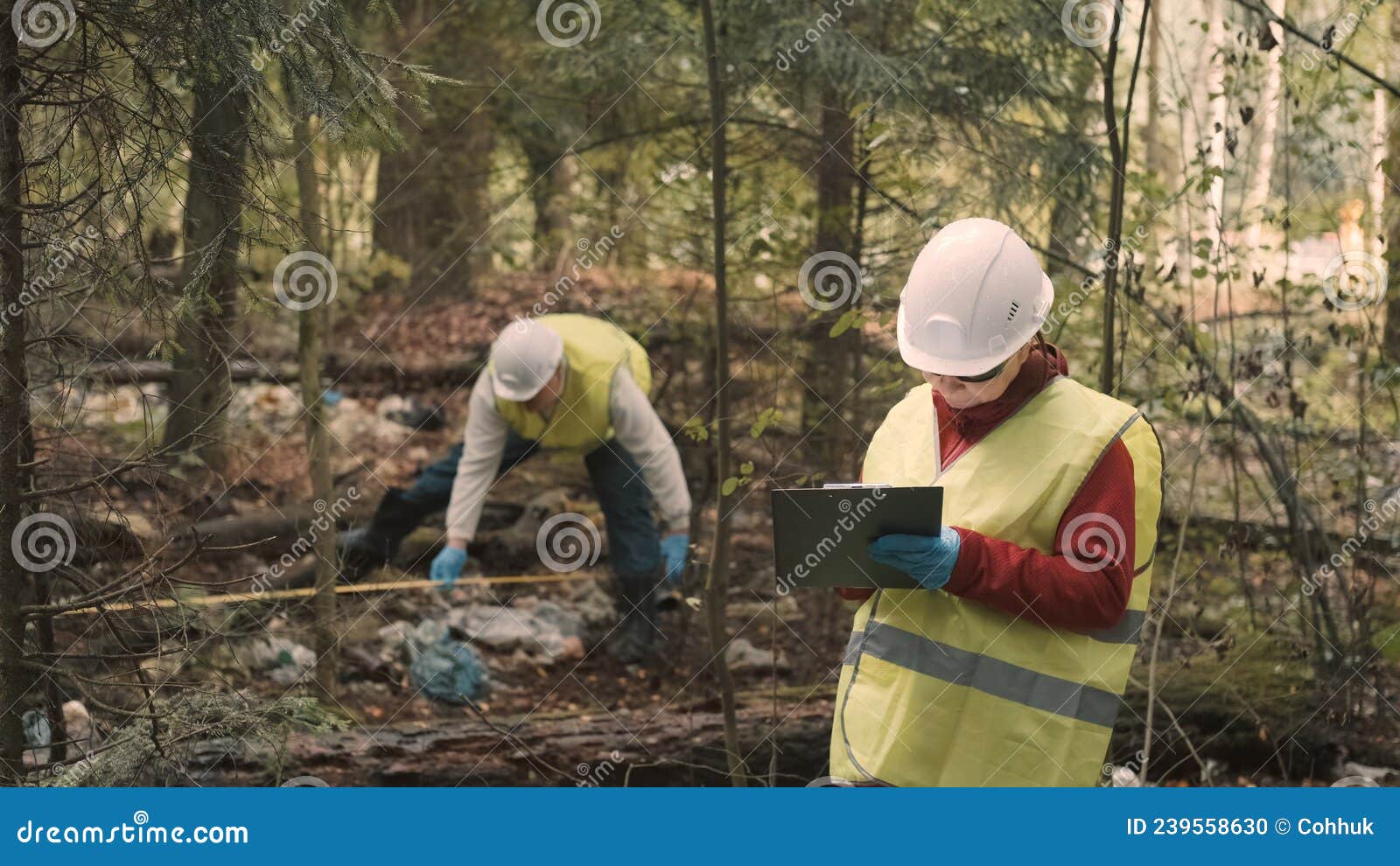 Ecologist Man in Workwear and Helmet Measures Diameter of Plastic Dump ...