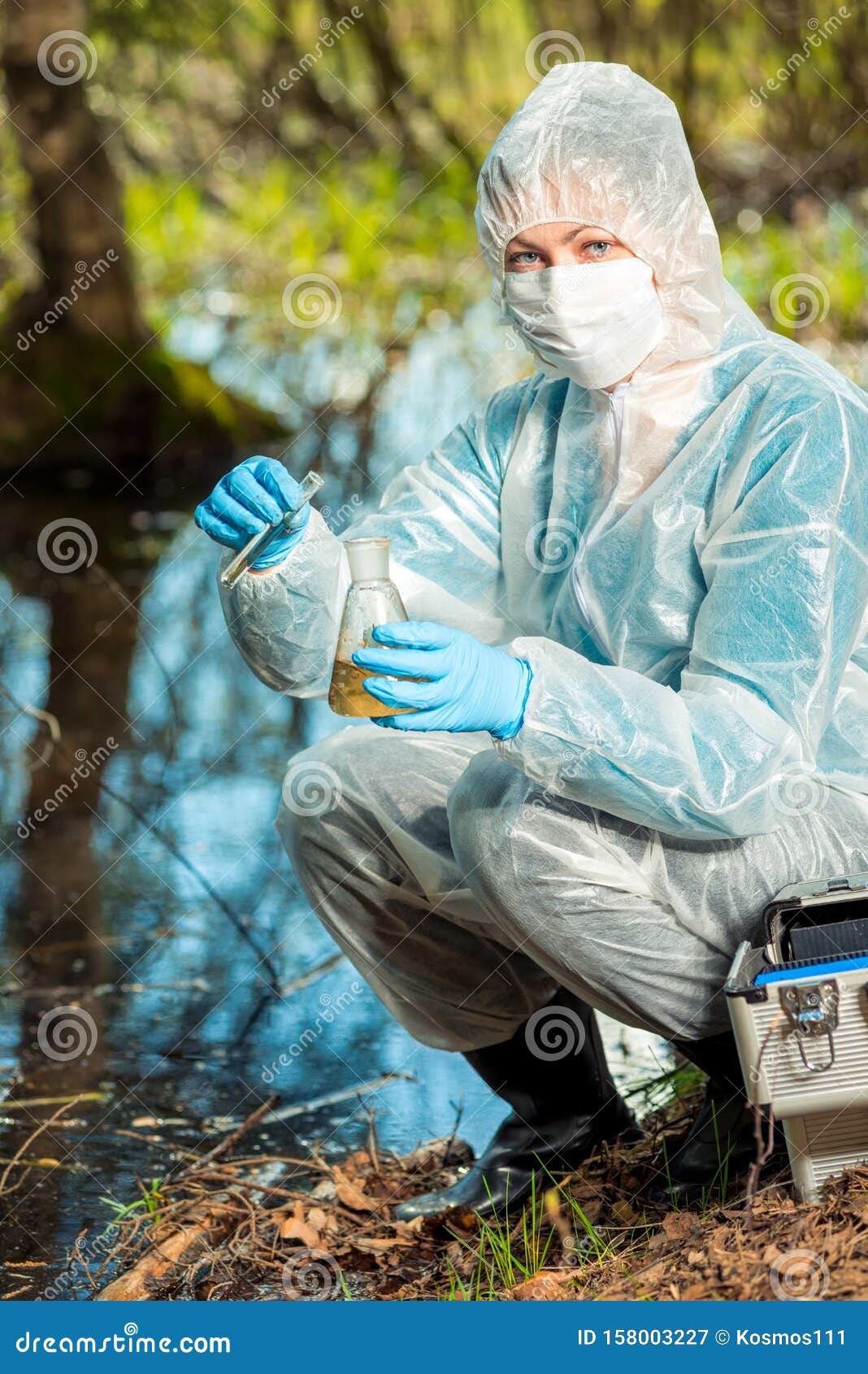 Ecologist and with Test Tubes and Flasks Analyzes Water Stock Image ...