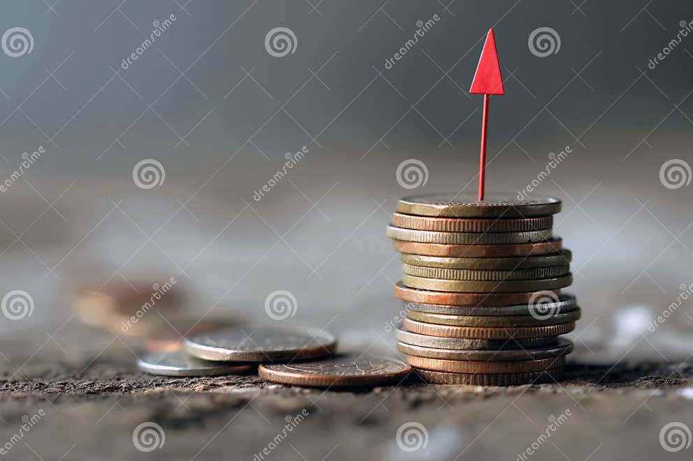 Economic Decline Represented by Coins and a Downward Arrow in Soft ...