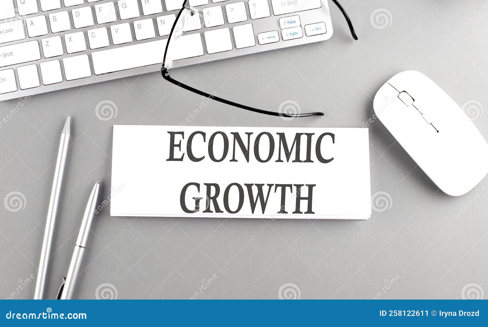 ECONOMIC GROWTH Text on Paper with Keyboard on Grey Background Stock ...