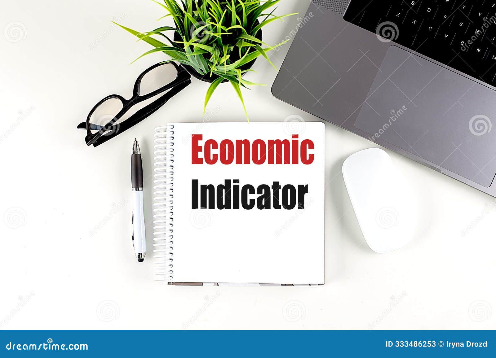 ECONOMIC INDICATOR Text on Notebook with Laptop, Mouse and Pen Stock ...