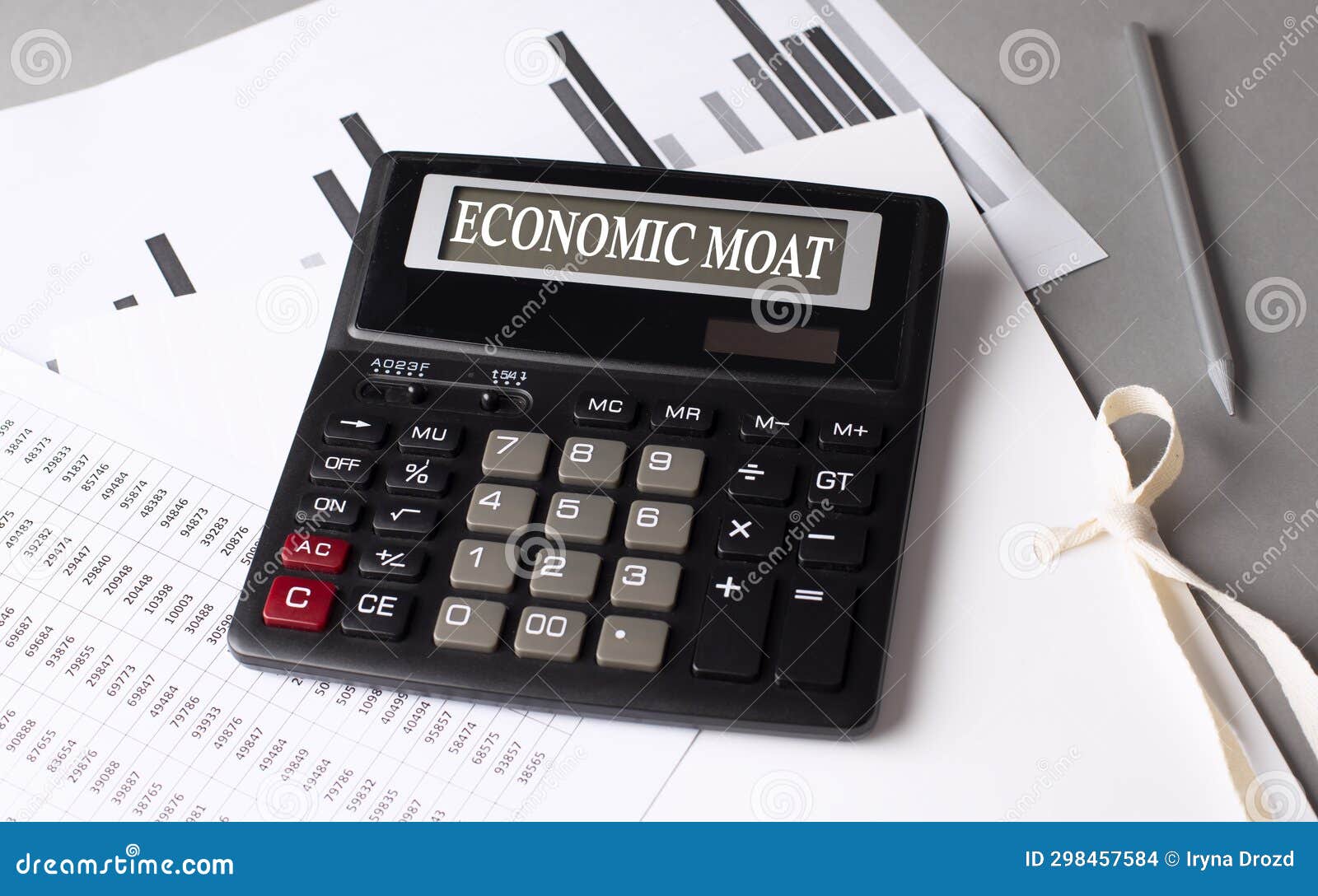 ECONOMIC MOAT Text on Calculator with Chart on Grey Background Stock ...
