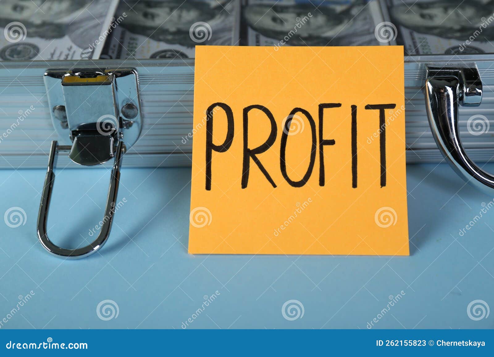Economic Profit. Note and Briefcase with Banknotes on Light Blue ...