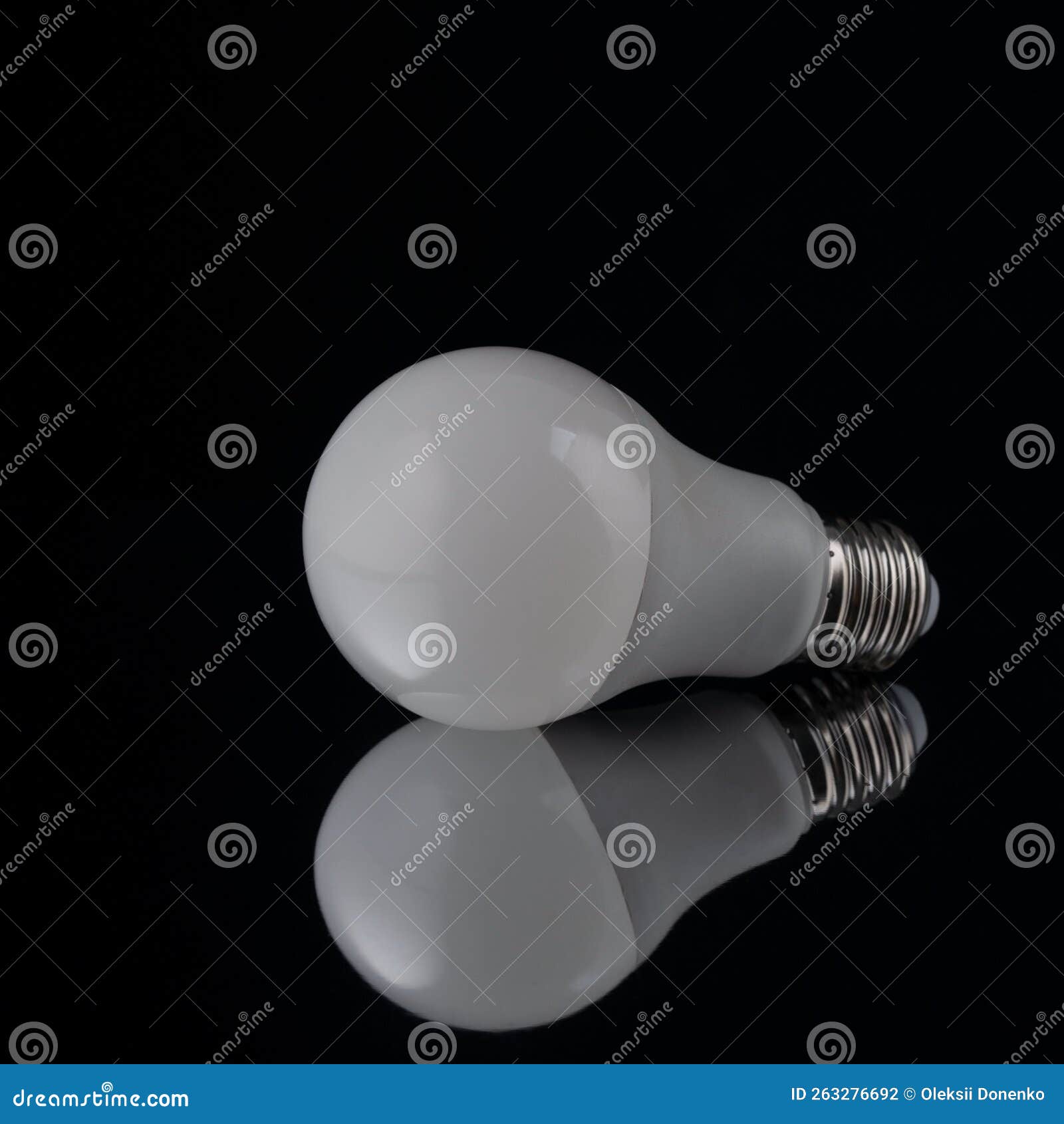 Economical White Light Bulb on Black Background Stock Photo - Image of ...