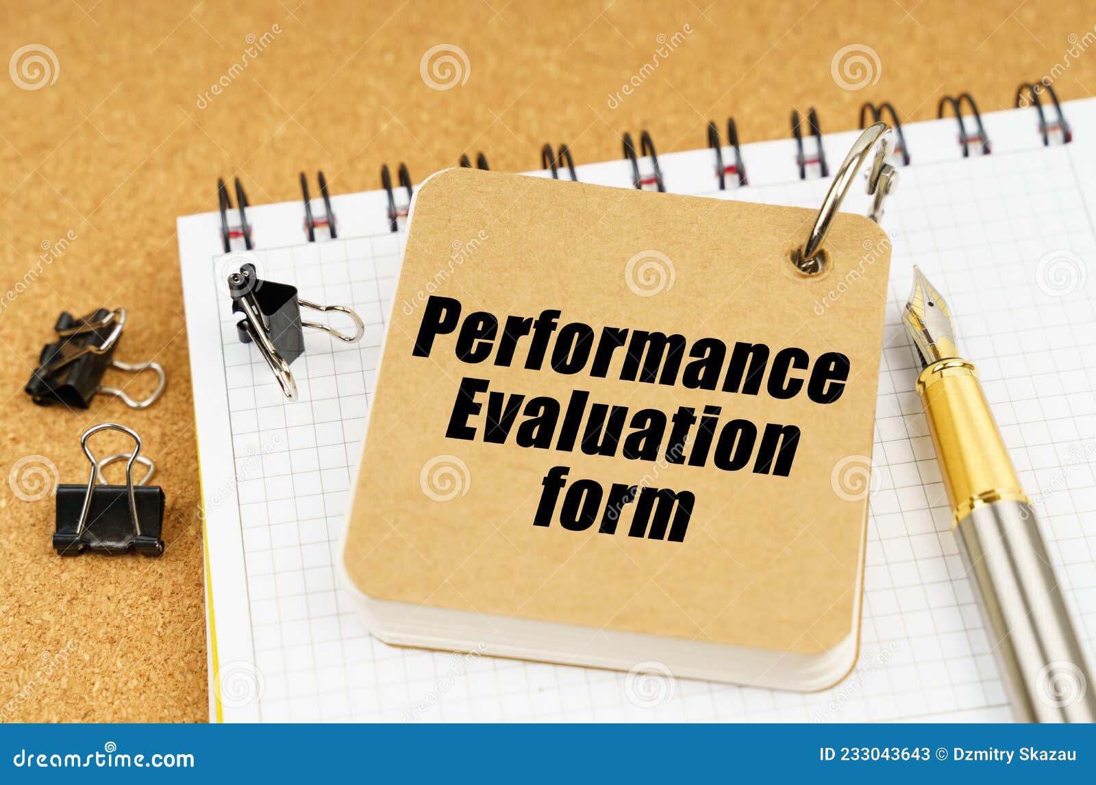 On the Table is a Pen and a Notebook with the Inscription - Performance ...