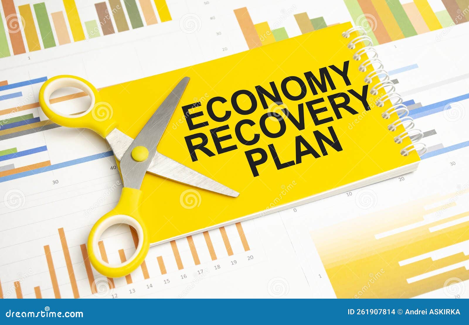 ECONOMY RECOVERY PLAN CONCEPT. Text on Yellow Notebook and Charts Stock ...