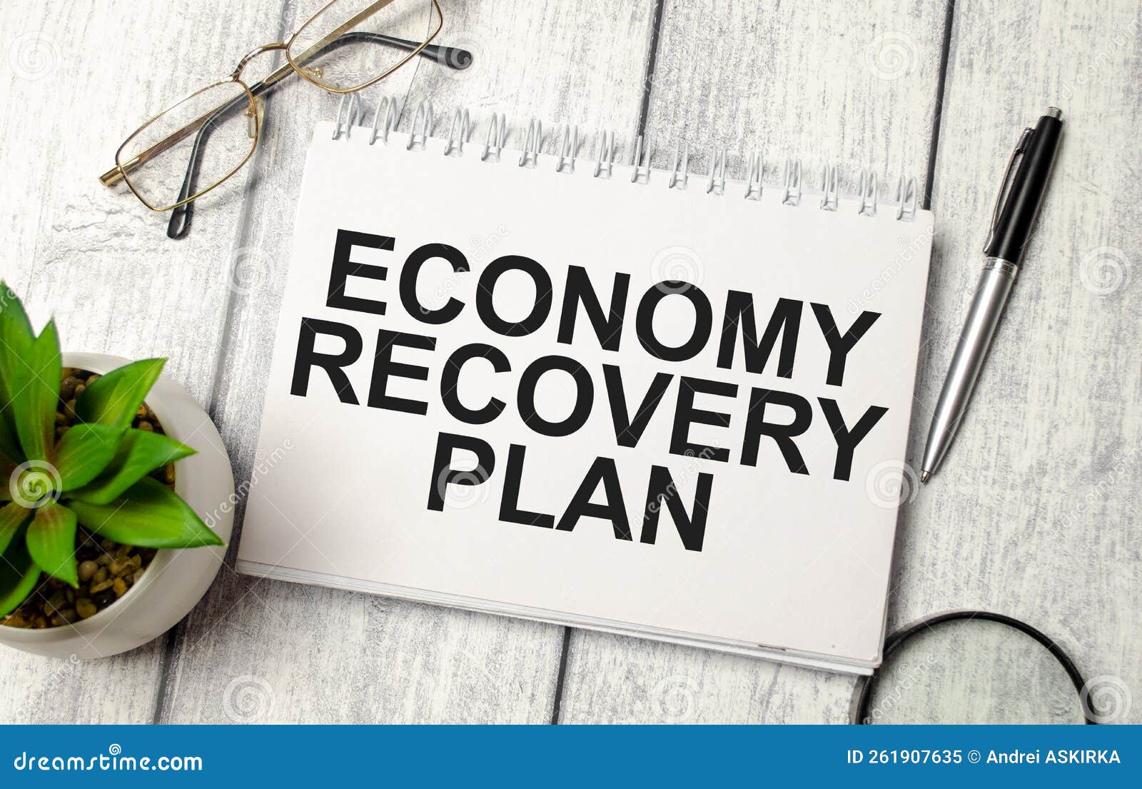 ECONOMY RECOVERY PLAN Words on Paper Notebook with Pen Stock Image ...