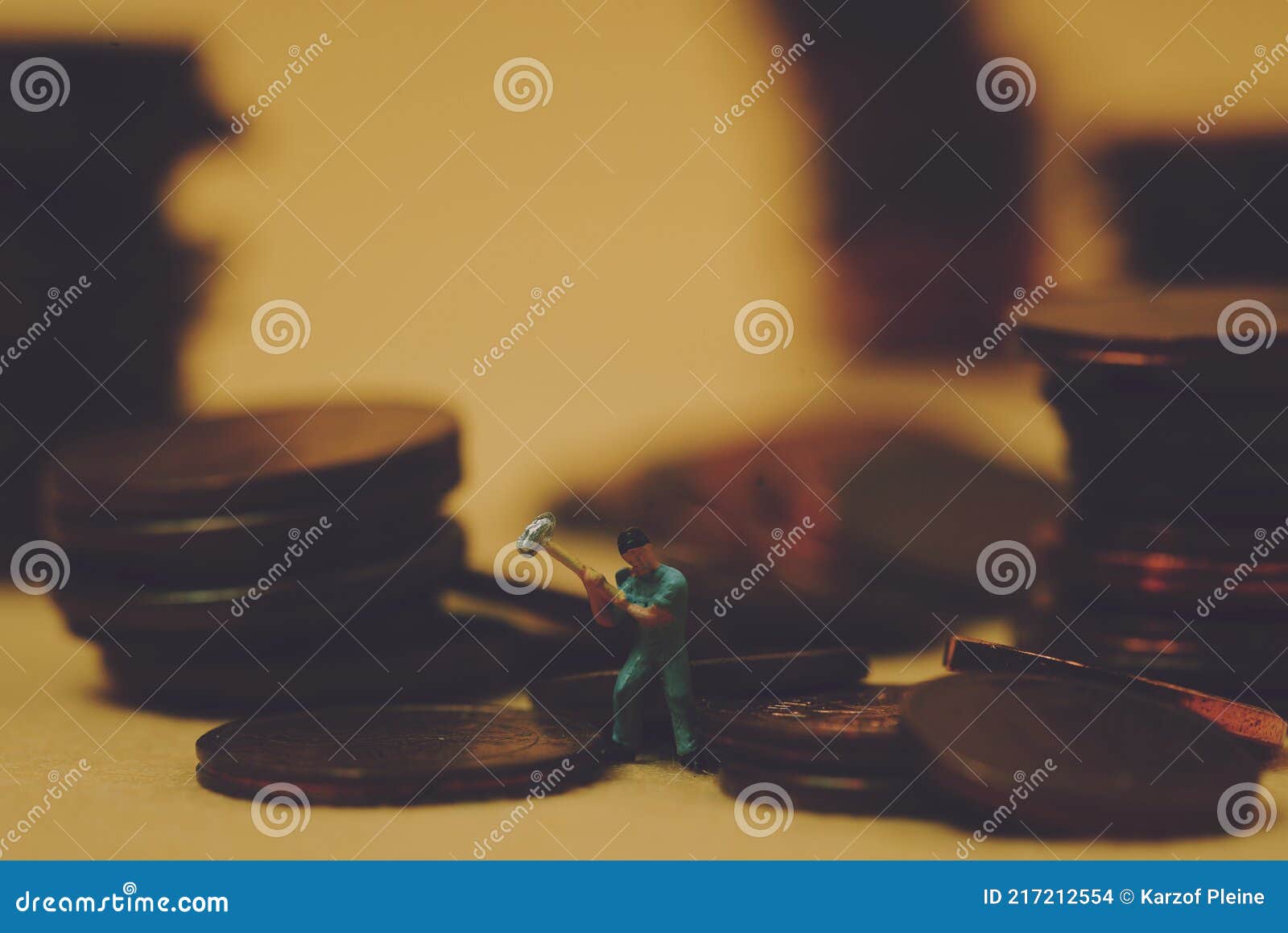 Economy and Work: Miniature Workers on Coins with a Yellow Background ...