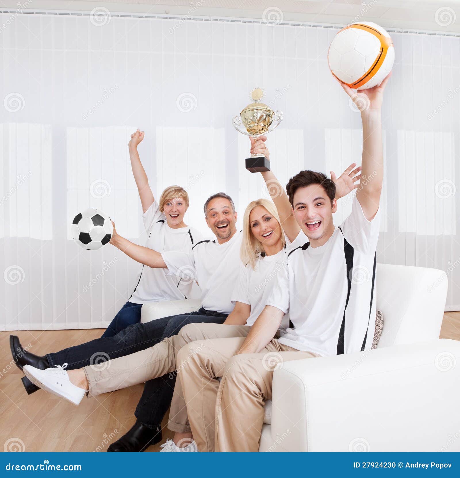 Ecstatic Family Celebrating a Win Stock Photo - Image of closeness ...