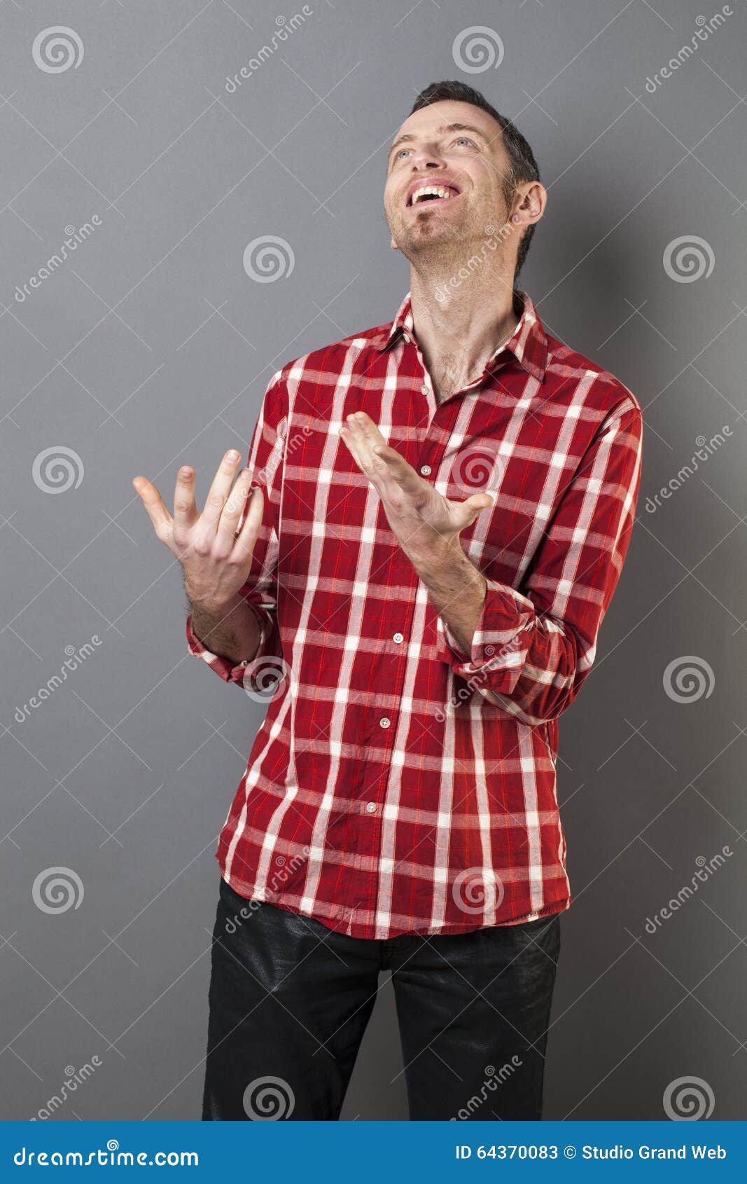Ecstatic 40s Man Looking at Something Dropping Down Stock Image - Image ...