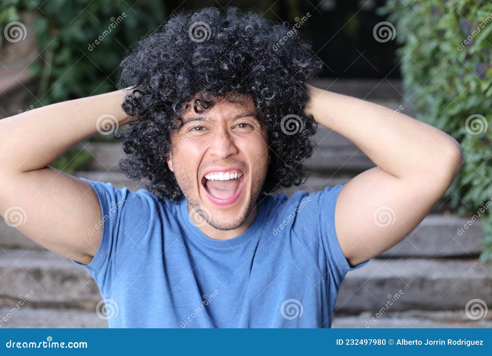 Ecstatic South American Man with Afro Hairstyle Screaming Stock Photo ...