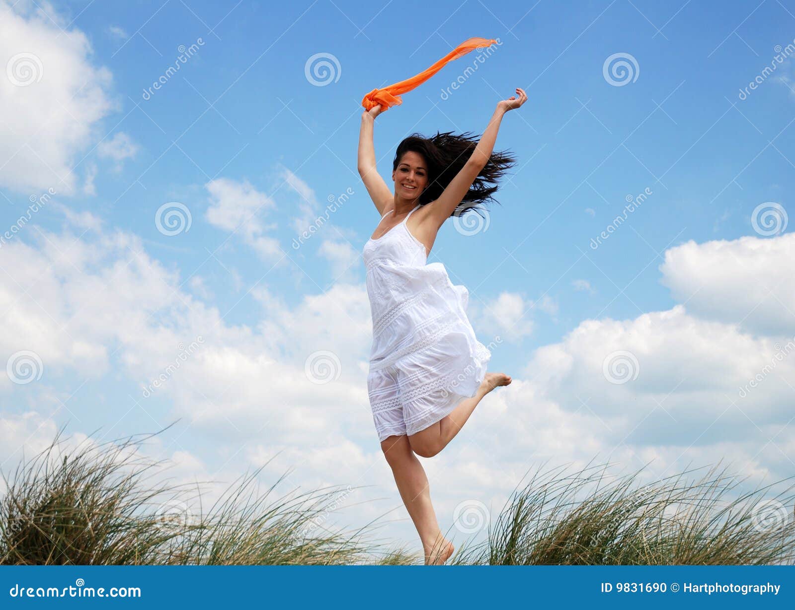 Ecstatic woman jumping stock photo. Image of jump, brown - 9831690