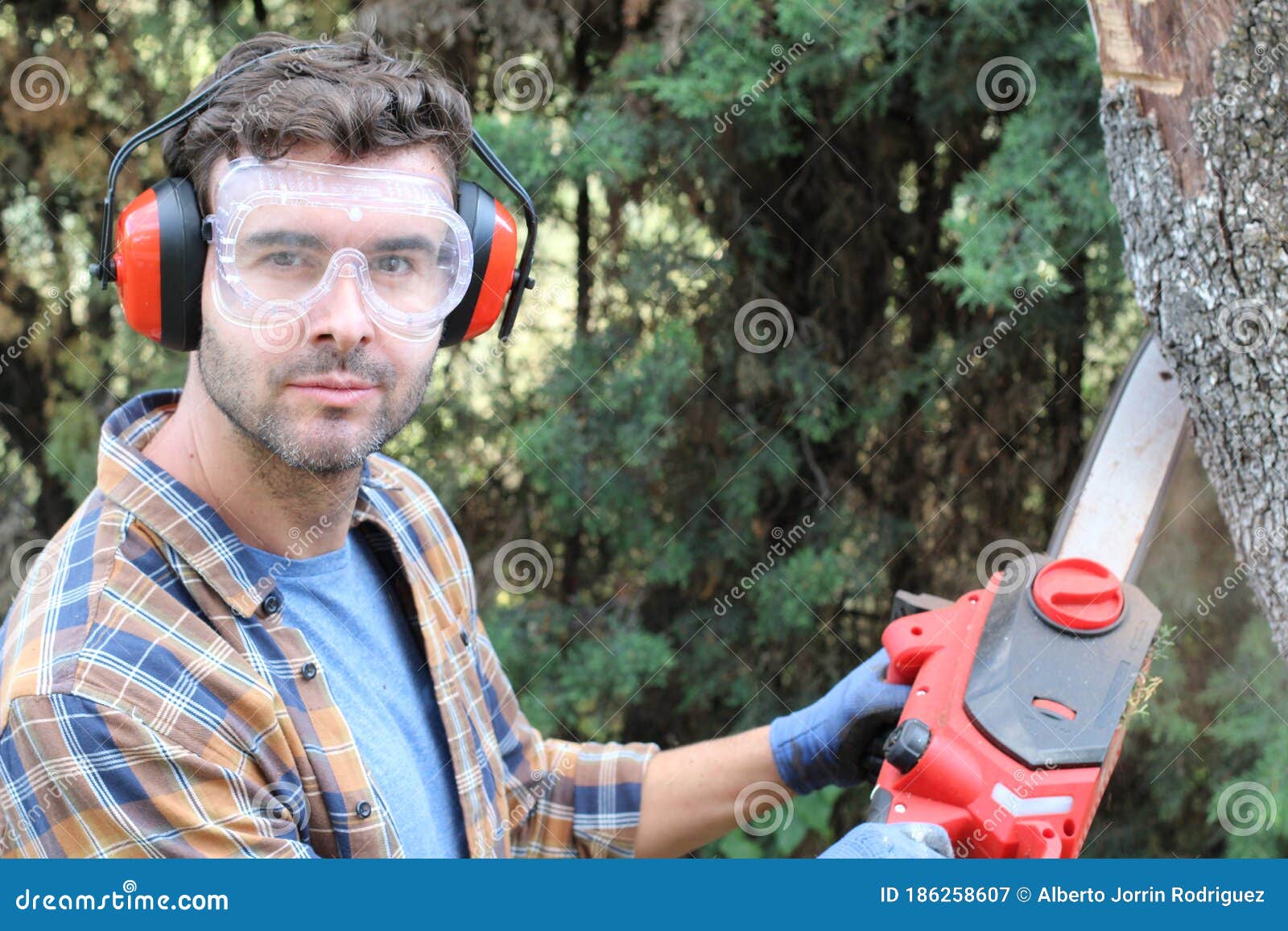Ecstatic Young Man Holding a Chainsaw Stock Image - Image of lumber ...