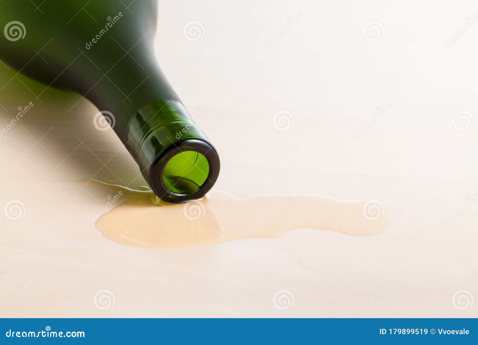 Edge Of Cognac Bottle In Spilled Liquid On Table Stock Image ...