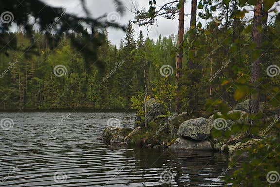 The edge of a lake stock image. Image of outdoors, rocks - 128651059