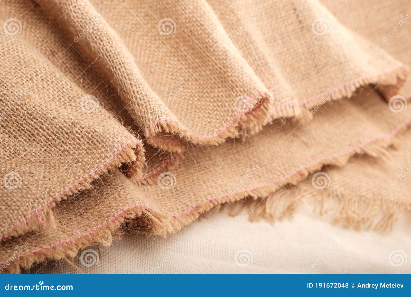 The Edge of Linen Fabric Gathered in Waves on a Light Surface Stock ...