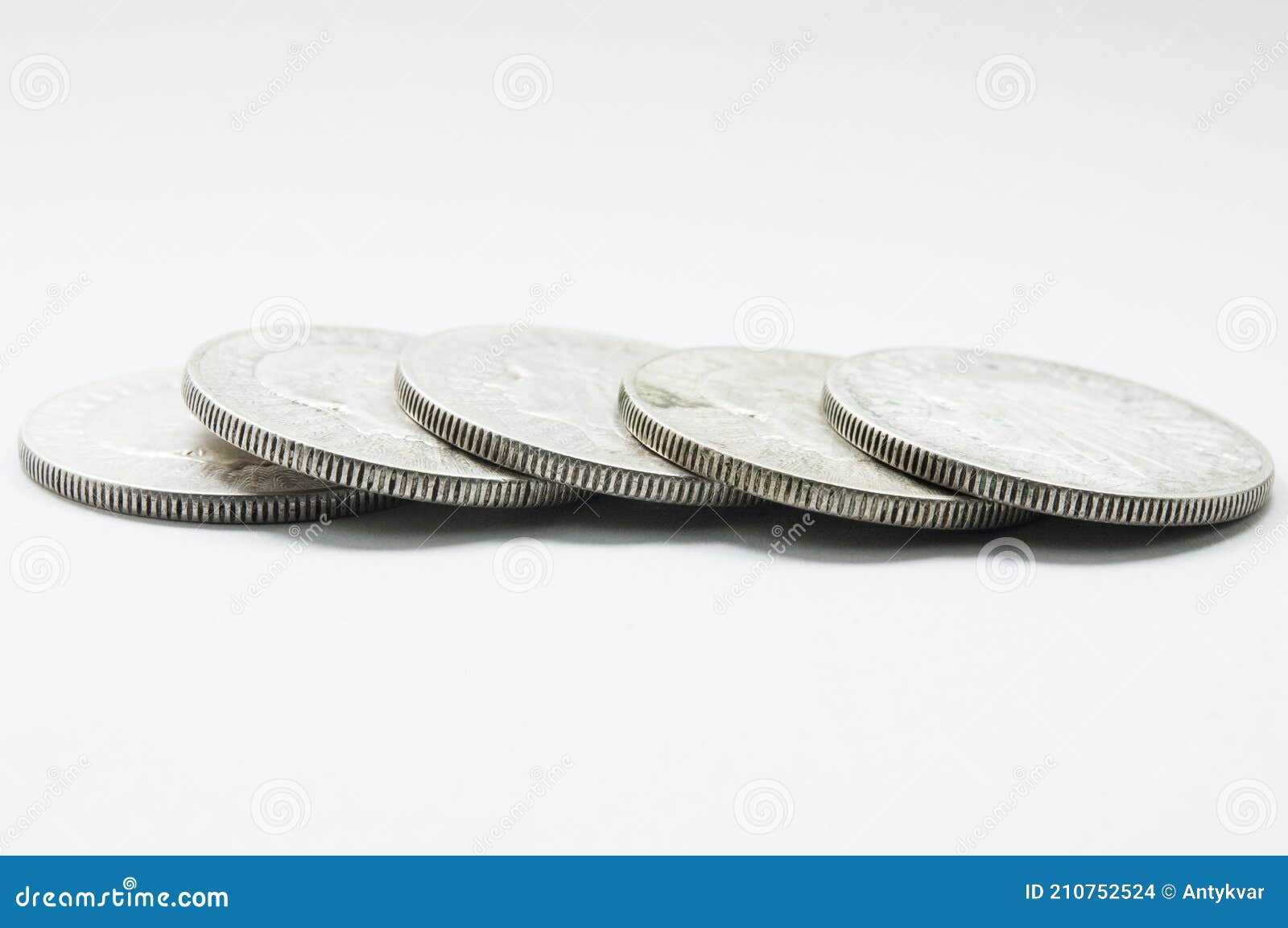 Edge of Old Silver Coins on White Background Stock Photo - Image of ...