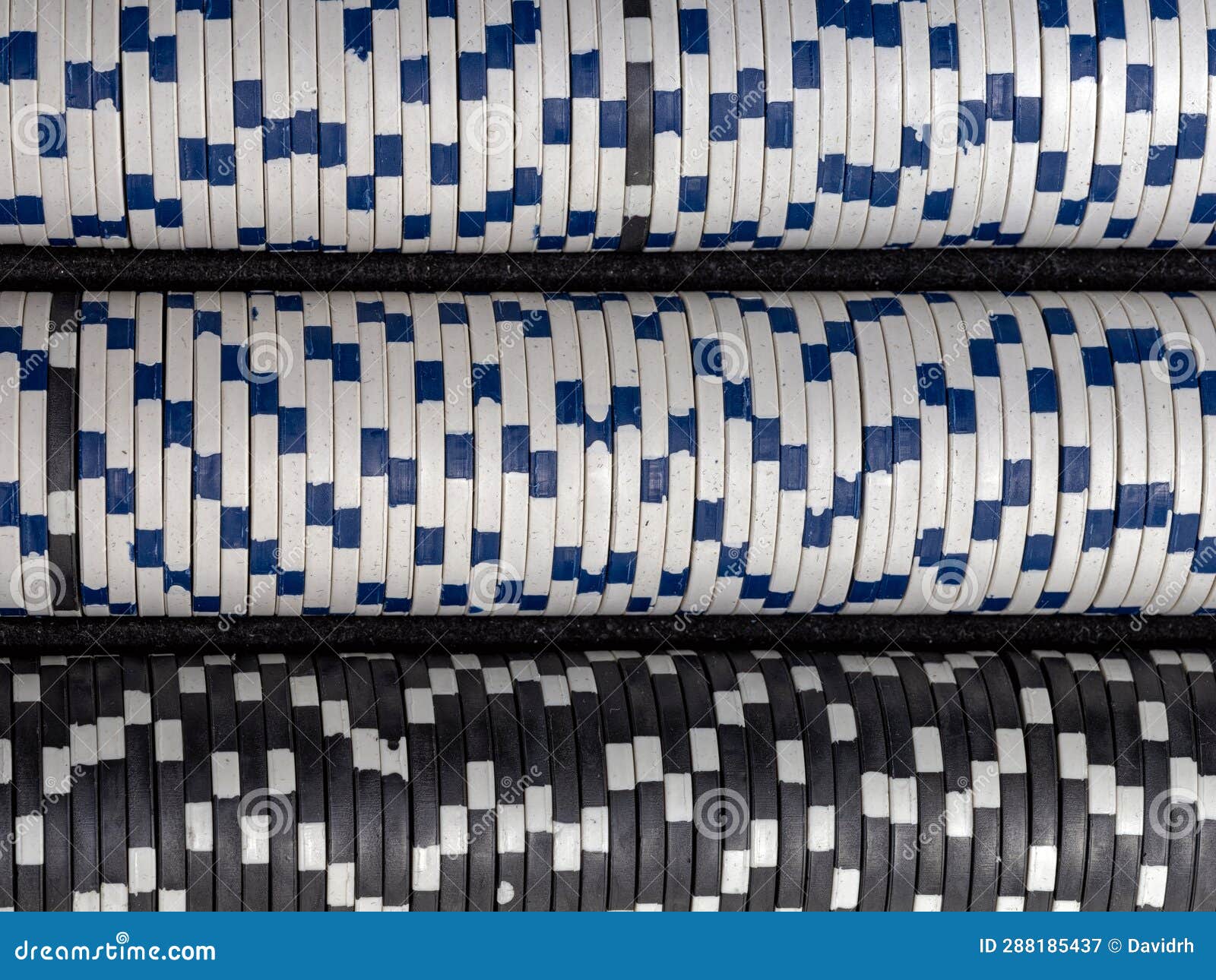 The Edges of Poker Chips Stacked Sideways in a Box Stock Image - Image ...