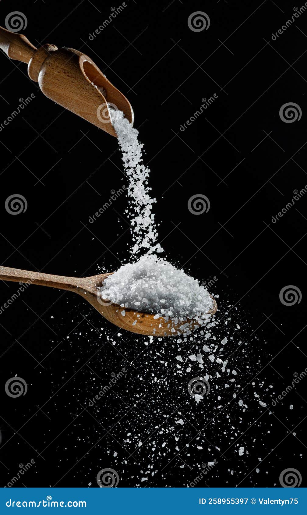 Edible Salt Crystals Falling Down into the Wooden Spoon at Black ...