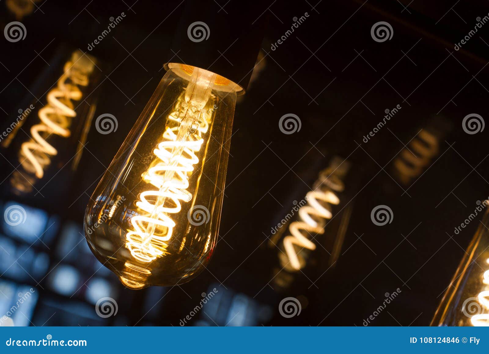 Edison Lightbulb with Red Neon Letters in the Background Stock Photo ...