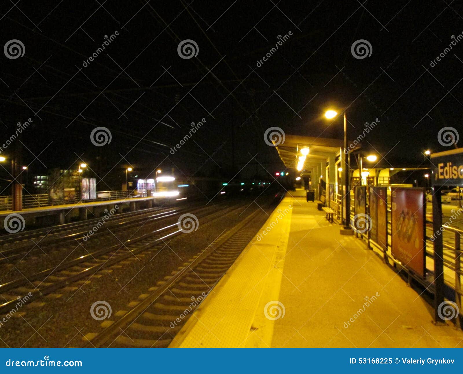 Edison Train Station Platform with Approaching Train on the Left and ...