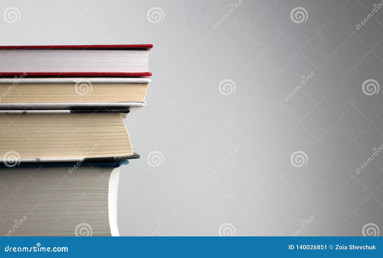 Education Concept. Bookshelf with Stack of Important Books on Grainy ...