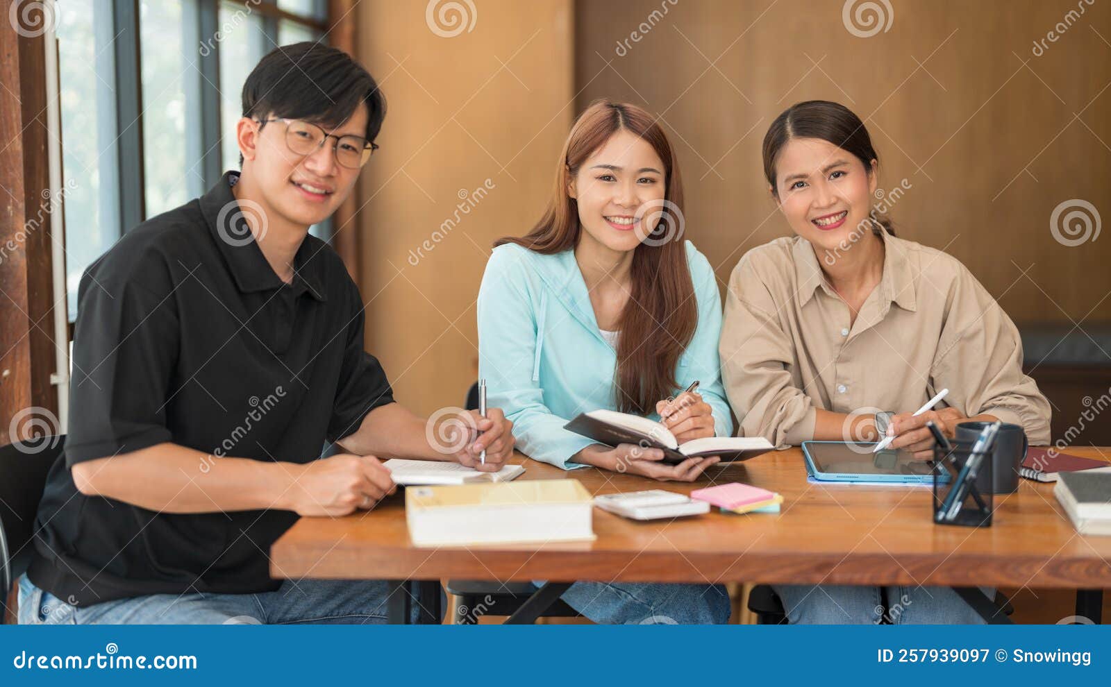 Education Concept, Female Tutor and Students Smiling and Looking on ...