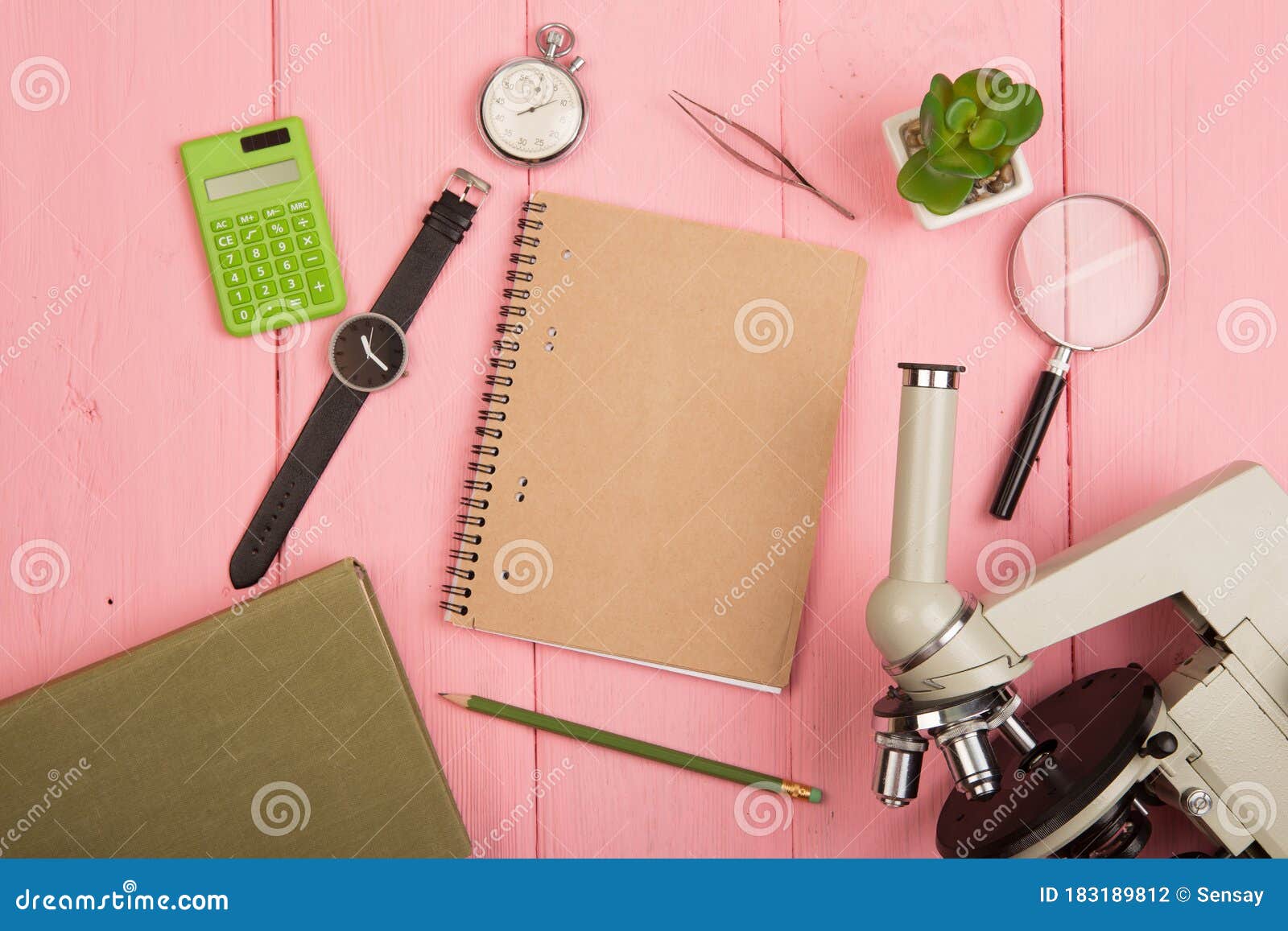Education Concept - Notepad, Microscope on the Pink Wooden Desk Stock ...