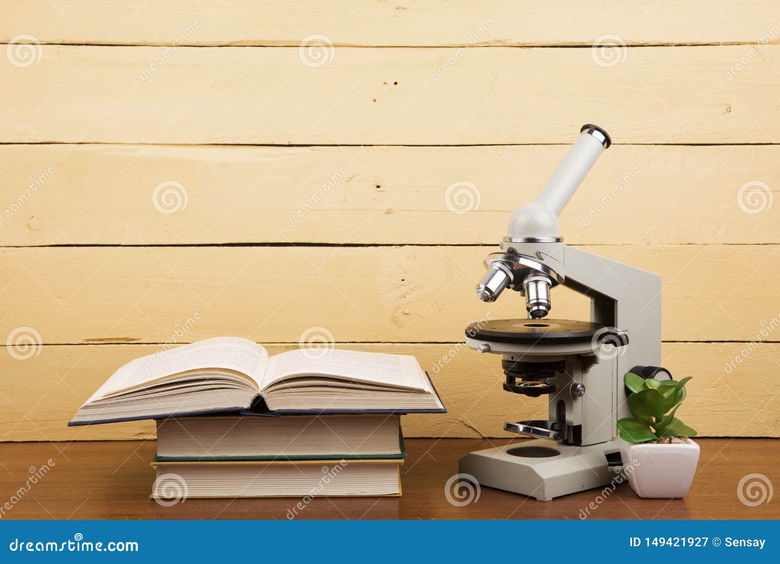 Education Concept - Notepad, Microscope on the Yellow Wooden Desk Stock ...