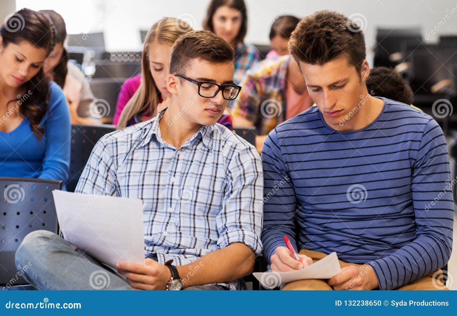 Group of Students with Papers in Lecture Hall Stock Photo - Image of ...