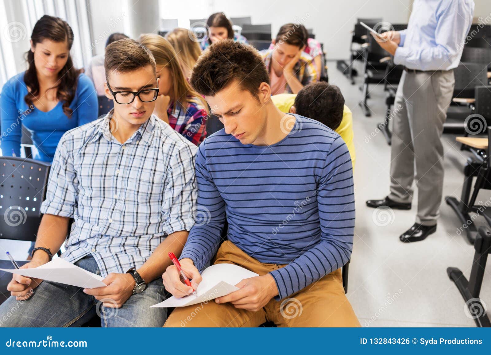Group of Students with Papers in Lecture Hall Stock Photo - Image of ...