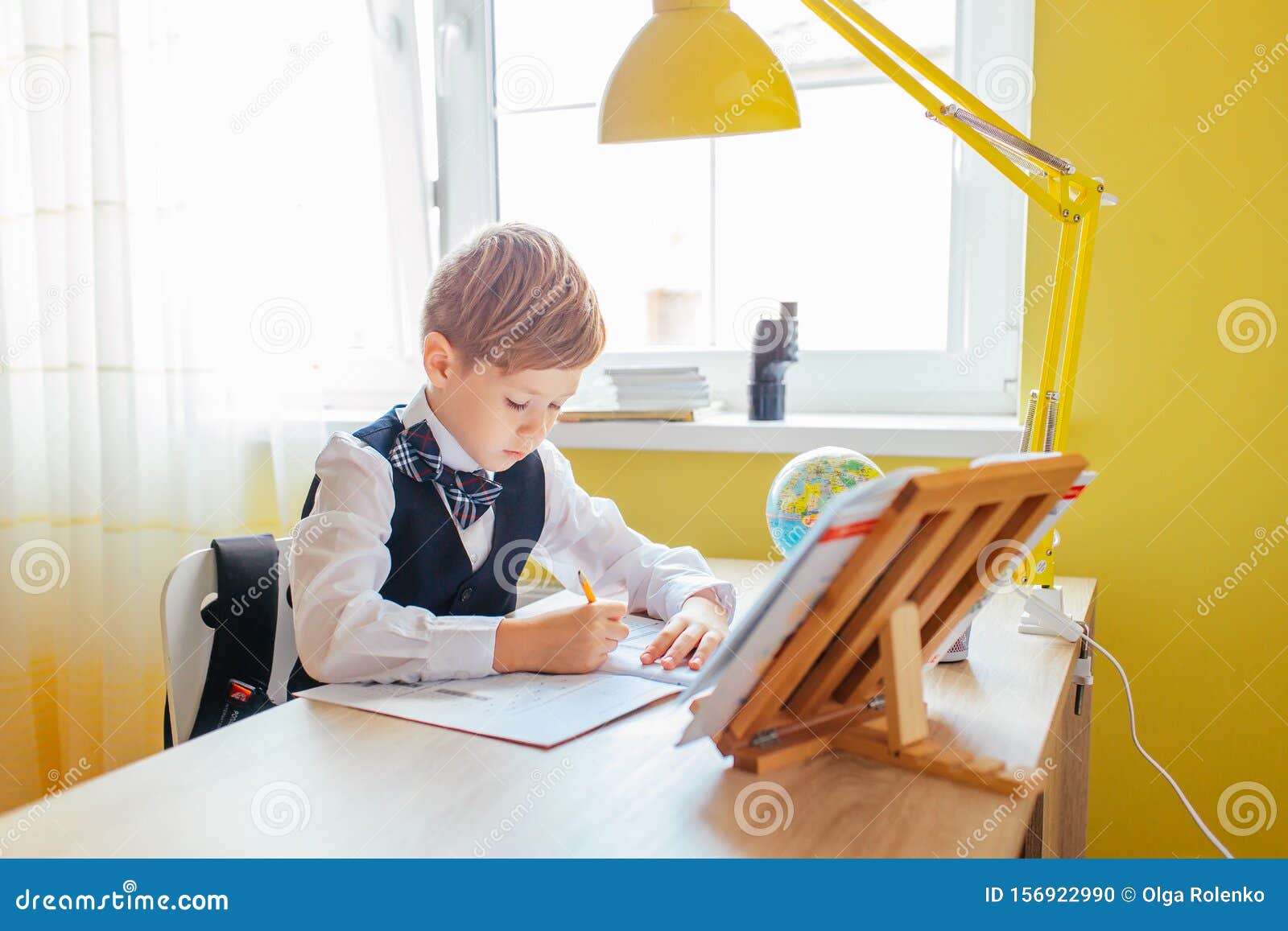 Education at Home Concept - Cute Little Boy Studying or Completing Home ...