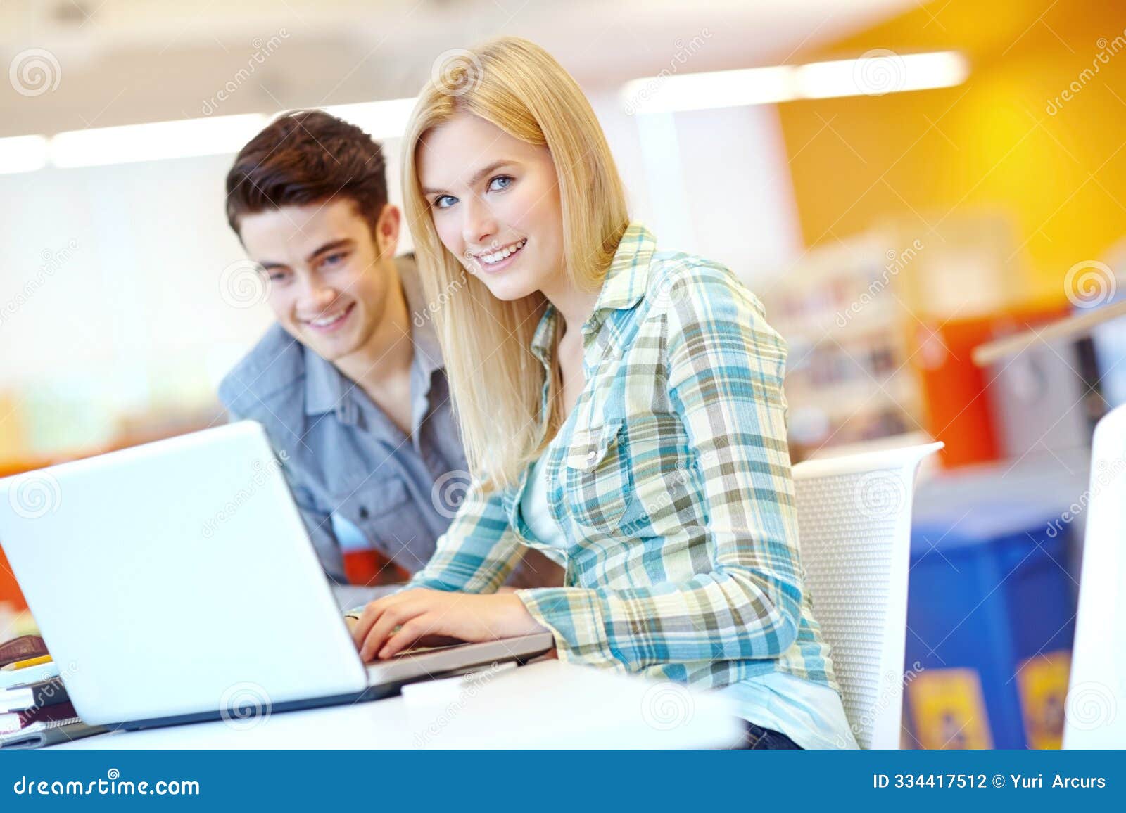 Education, Laptop and Smile of Student Friends in Library at College or ...