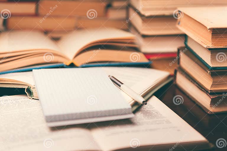 Education Learning Concept with Open Book and Notebook on the Table ...