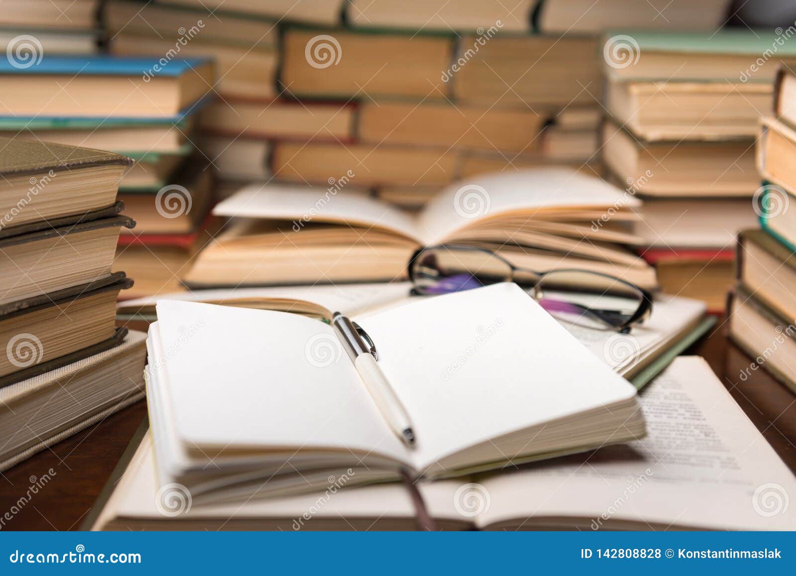 Education Learning Concept with Open Book and Notebook on the Table ...