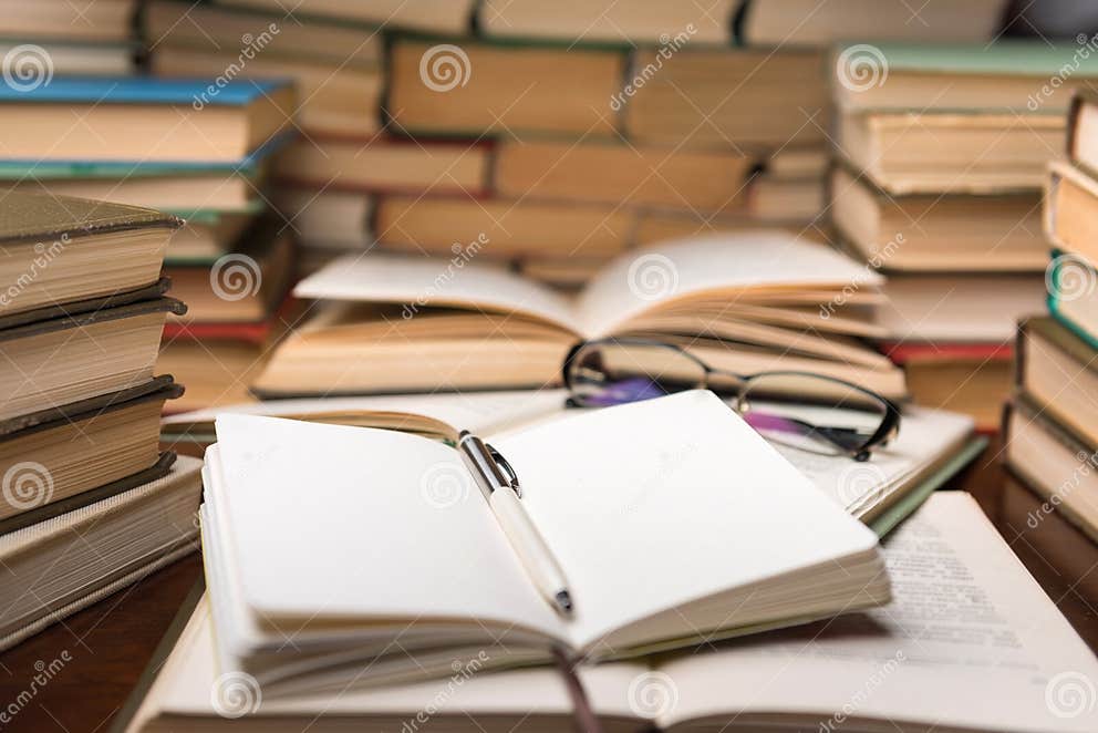 Education Learning Concept with Open Book and Notebook on the Table ...