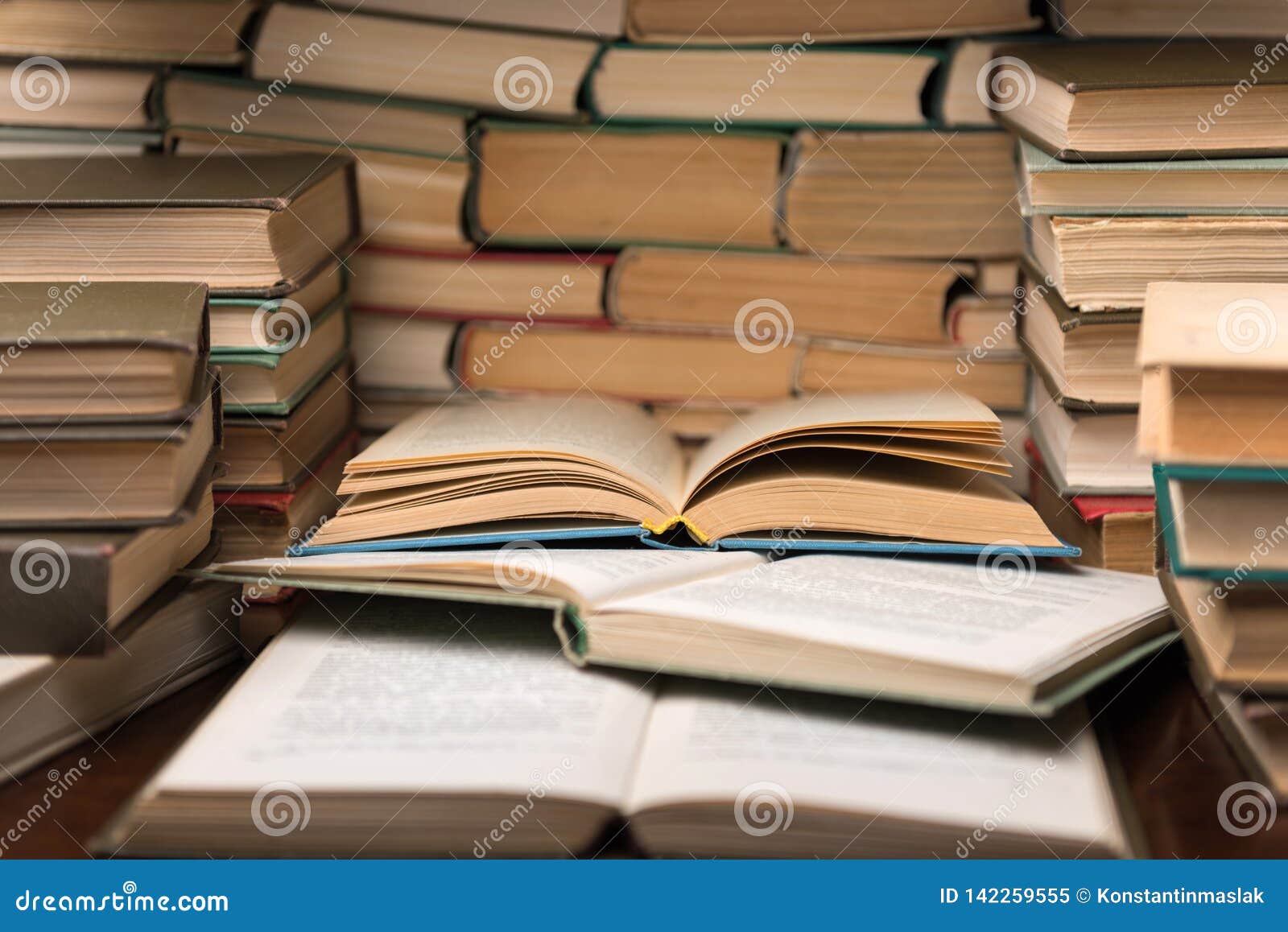 Open Notebook on the Table, on the Background of Books Stock Image ...