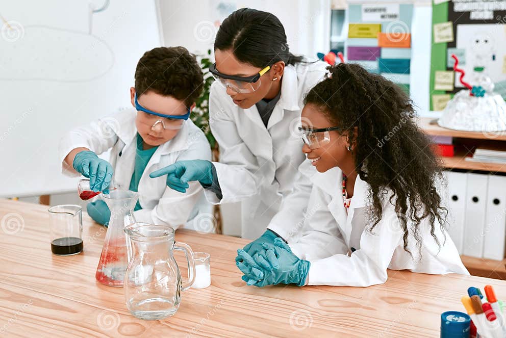 Education, Learning or Science with Teacher and Students at Table in ...